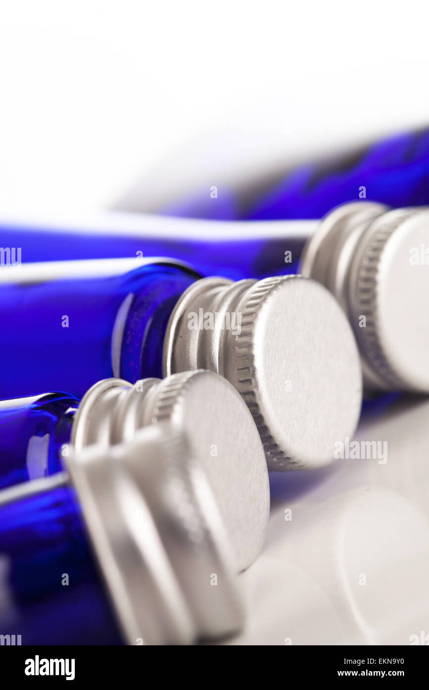 Closeup image of blue bottles Stock Photo - Alamy