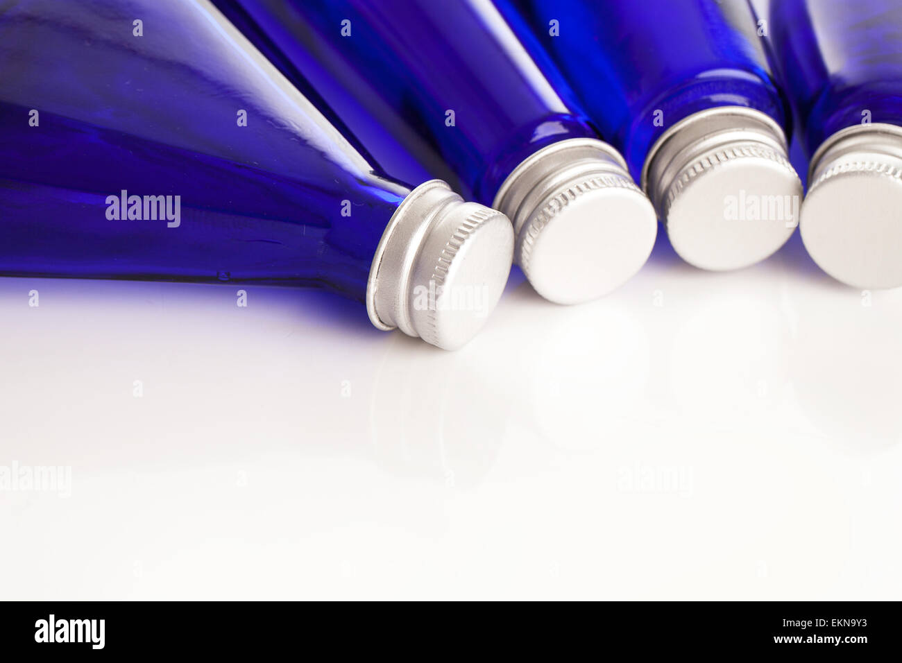 Closeup image of blue bottles Stock Photo - Alamy