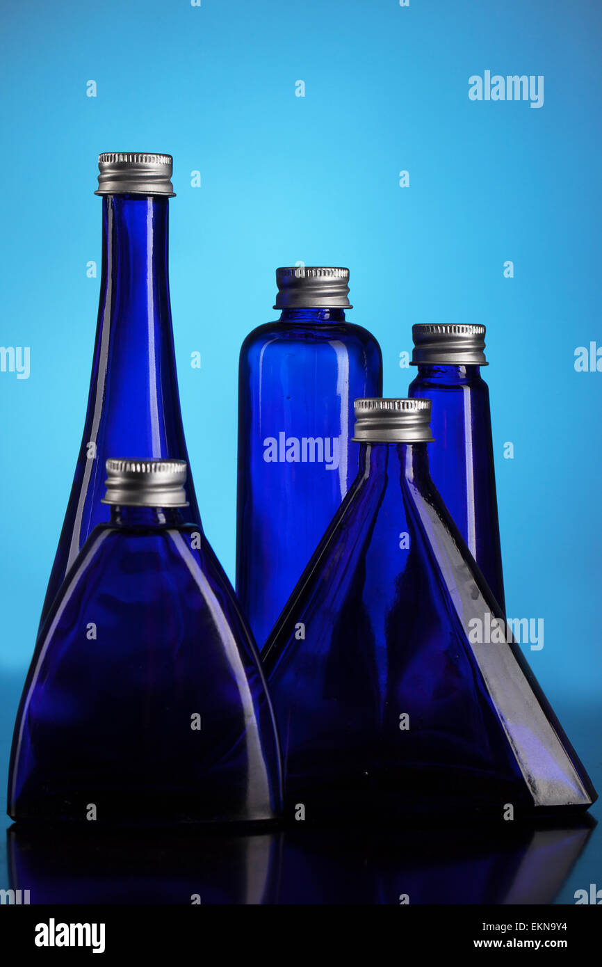 Little blue bottles on a background Stock Photo - Alamy