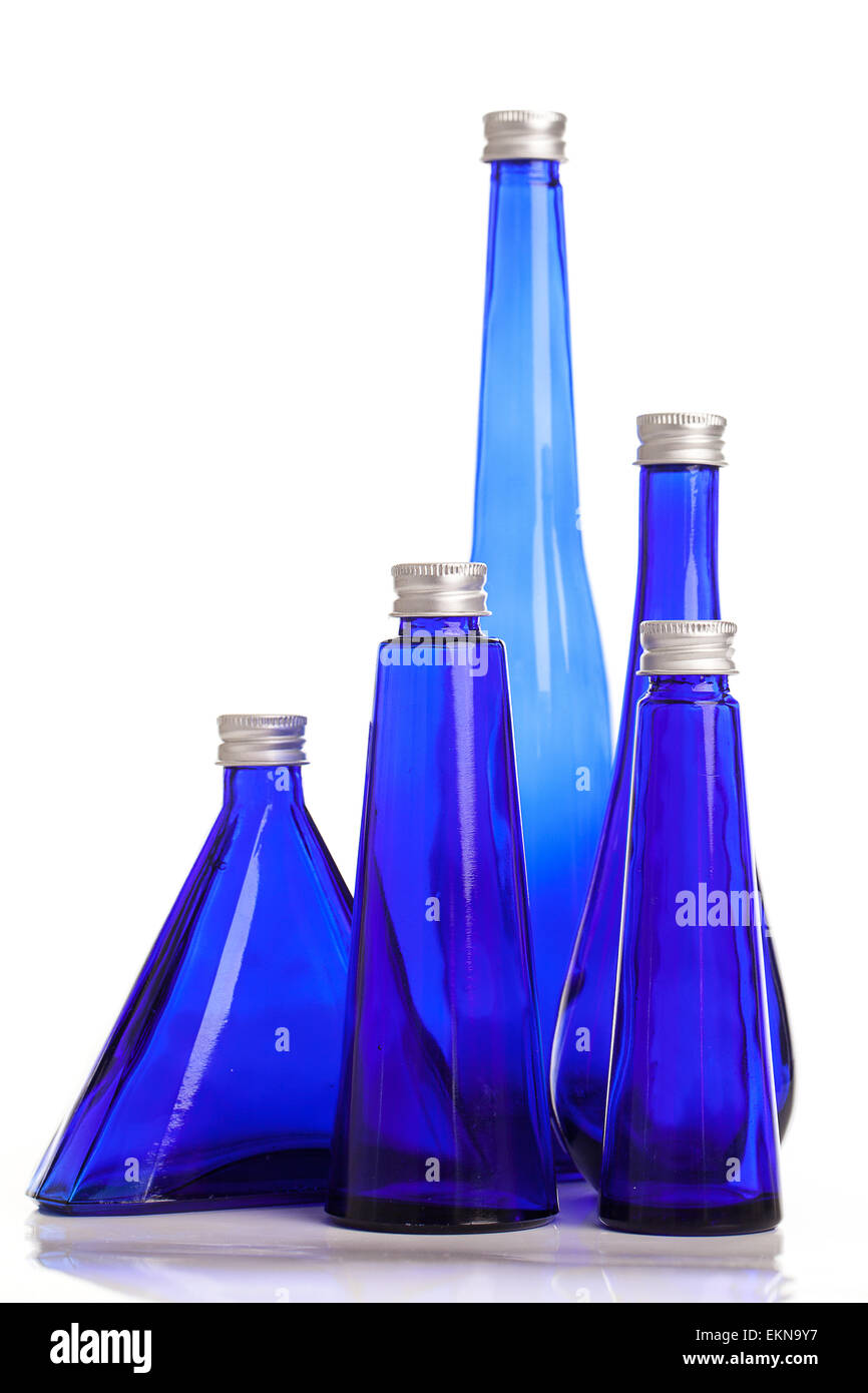 Little blue bottles isolated Stock Photo - Alamy