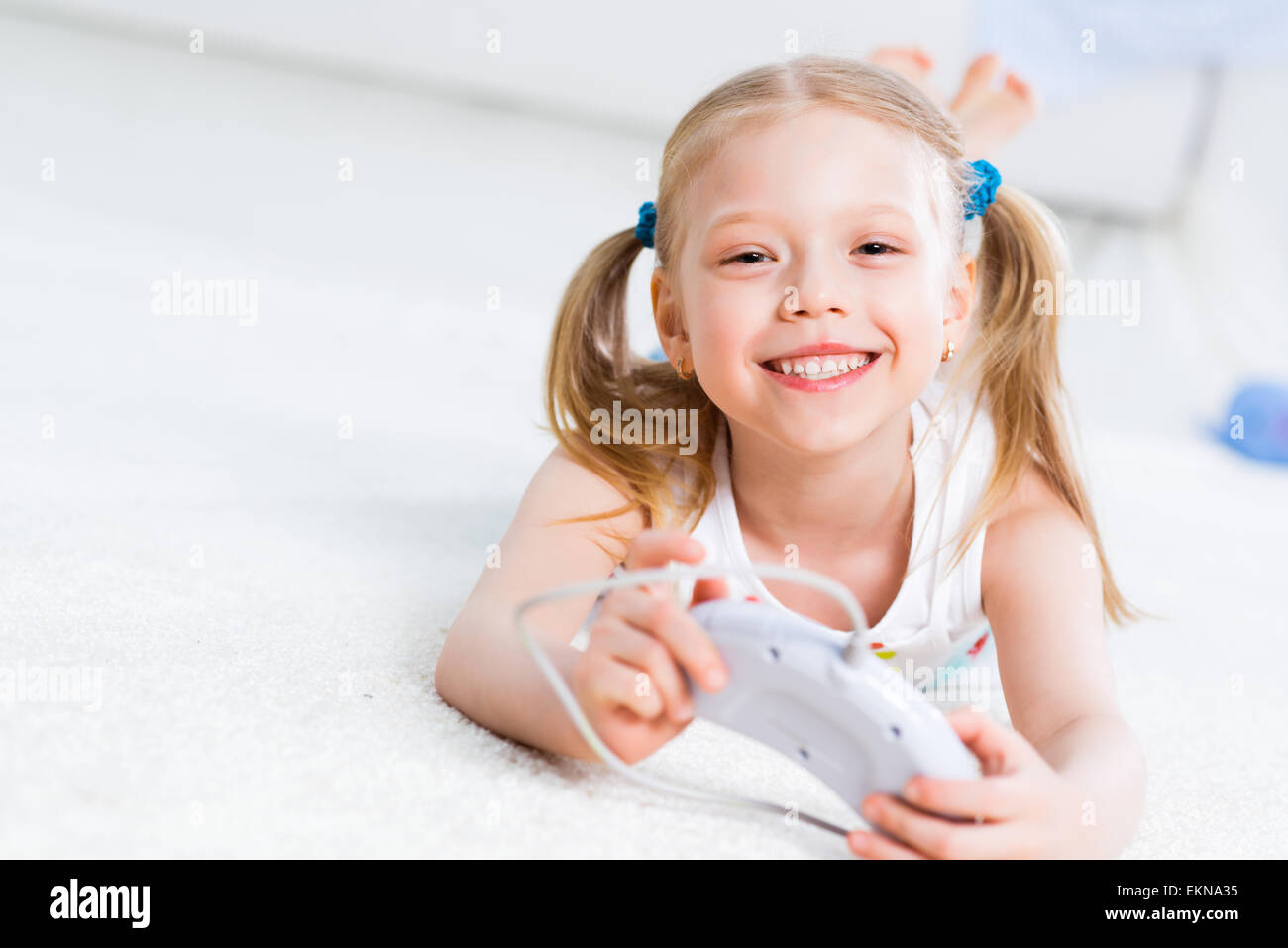 girl playing on a game console Stock Photo - Alamy