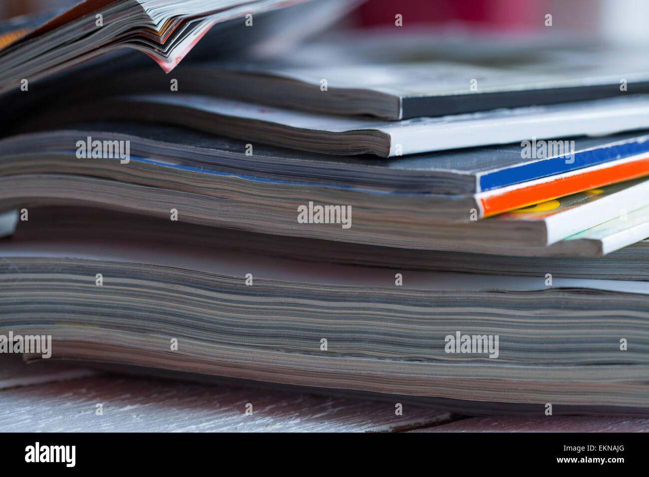 Pile of colorful magazines on a table Stock Photo - Alamy