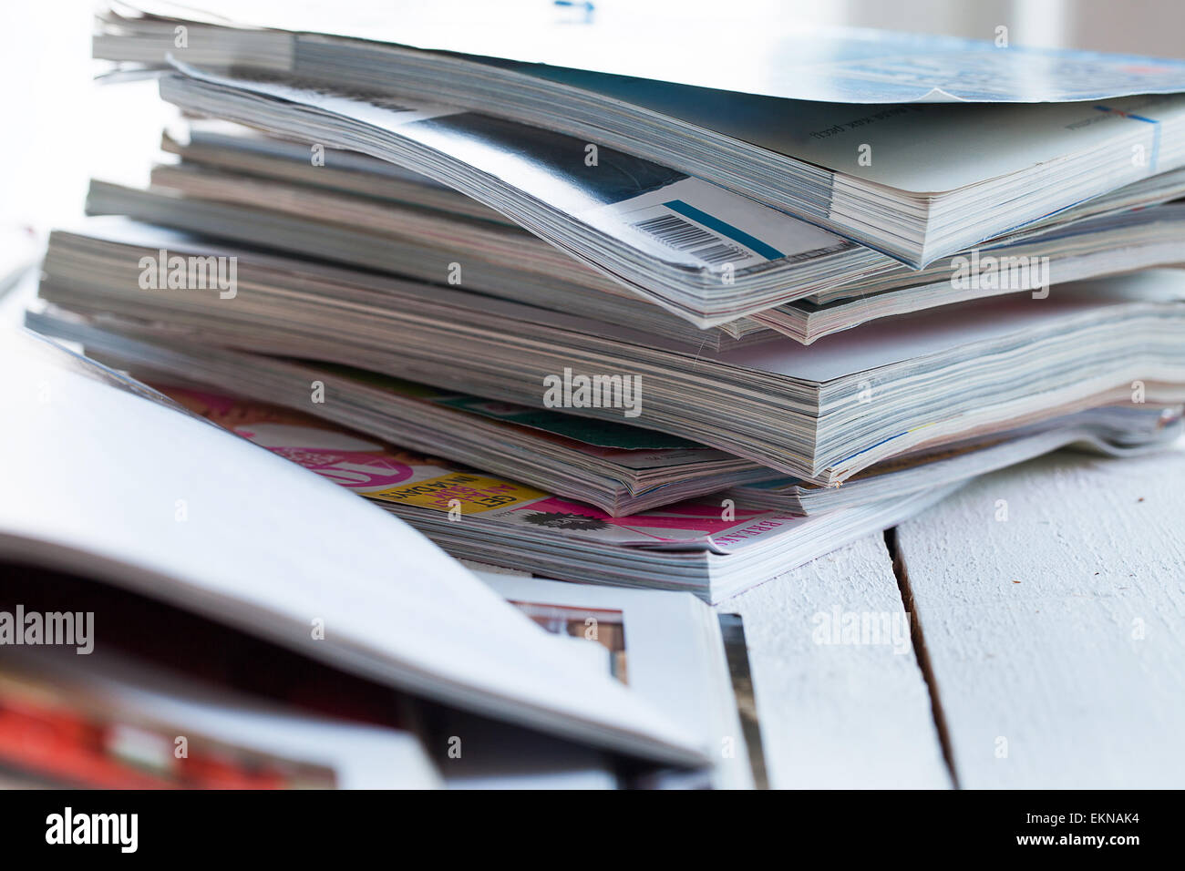 Pile of colorful magazines on a table Stock Photo - Alamy