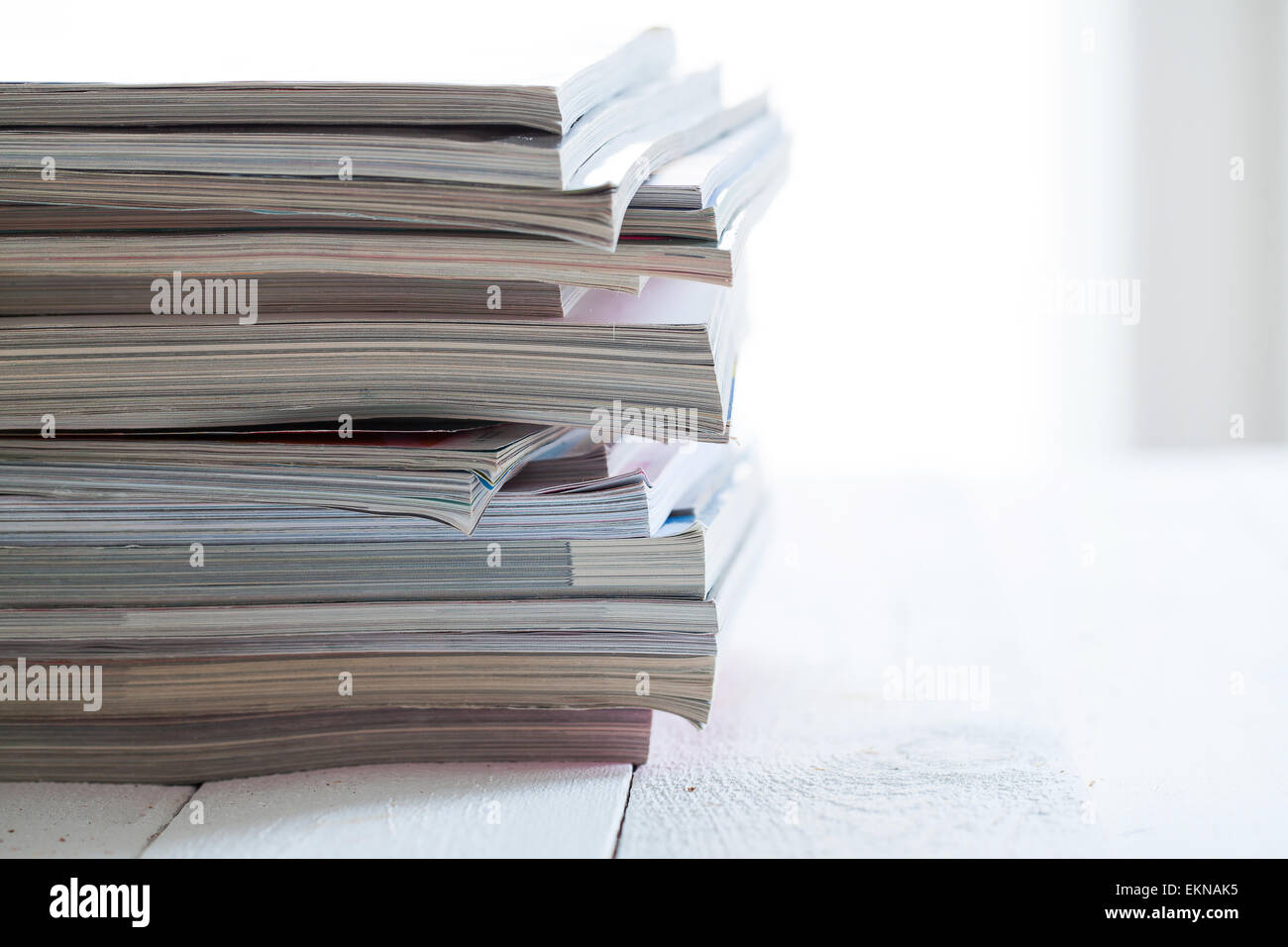 Pile of colorful magazines on a table Stock Photo - Alamy