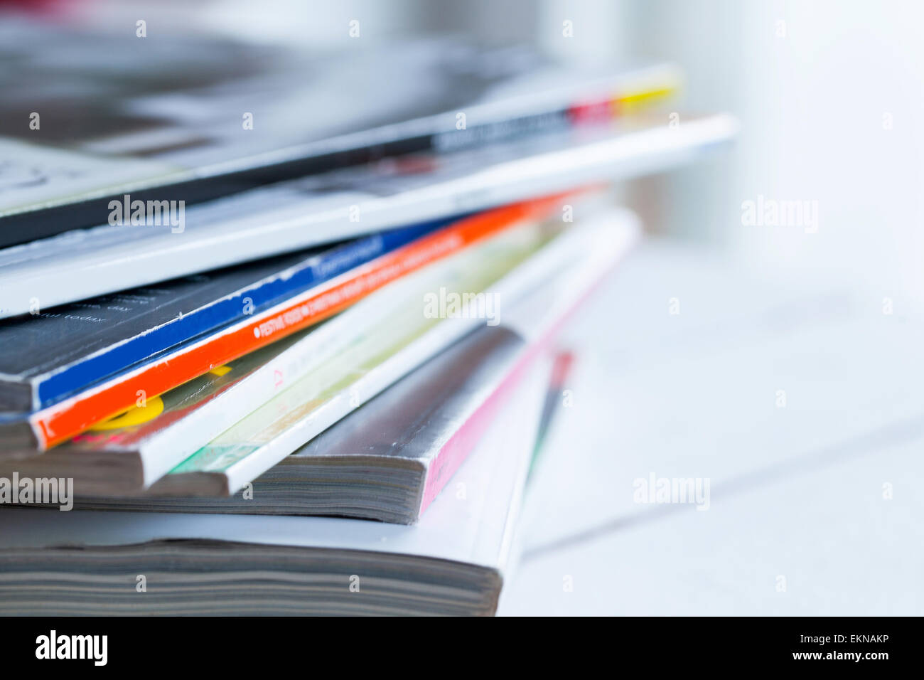 Pile of colorful magazines on a table Stock Photo - Alamy