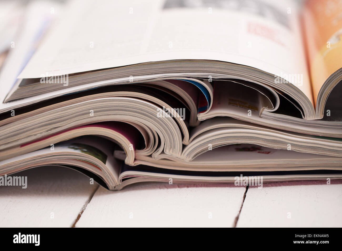 Pile of colorful magazines on a table Stock Photo - Alamy