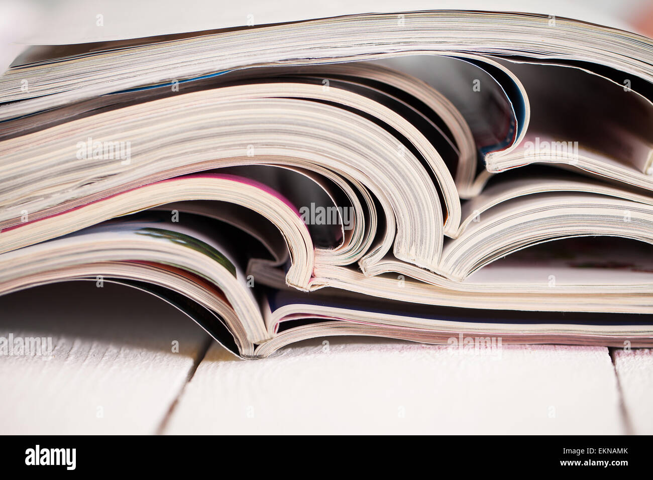Pile of colorful magazines on a table Stock Photo - Alamy