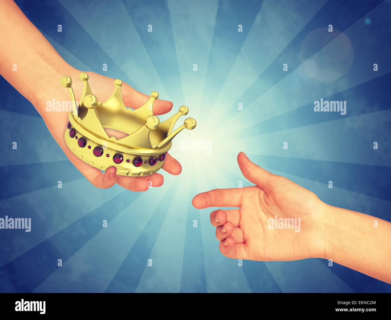 Hand passing gold crown Stock Photo - Alamy