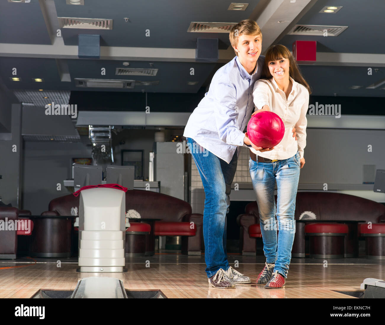young couple plays bowling Stock Photo - Alamy