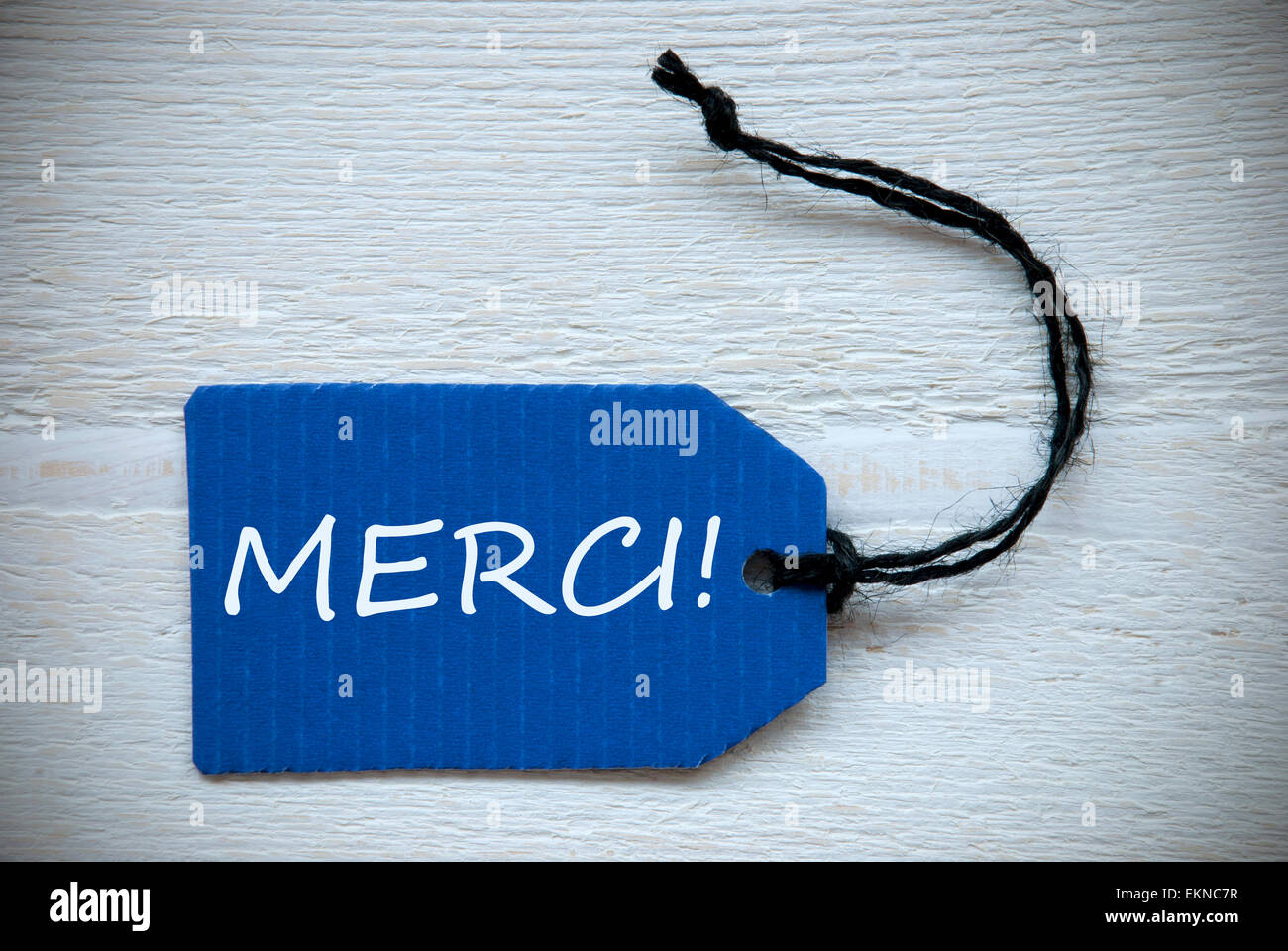 Blue Label Or Tag With Black Ribbon On White Wooden Background With ...