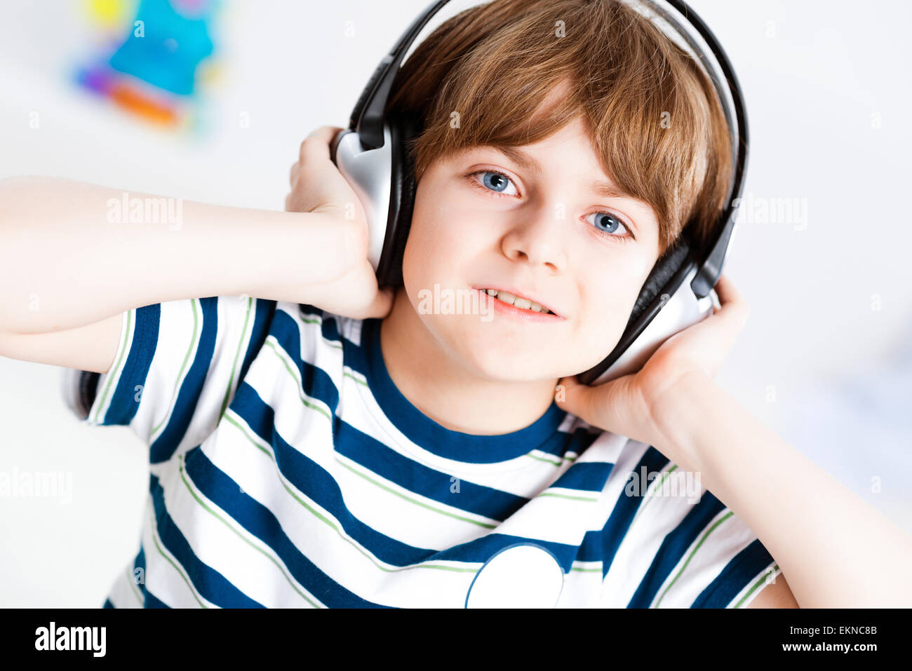 Boy listening to music Stock Photo - Alamy