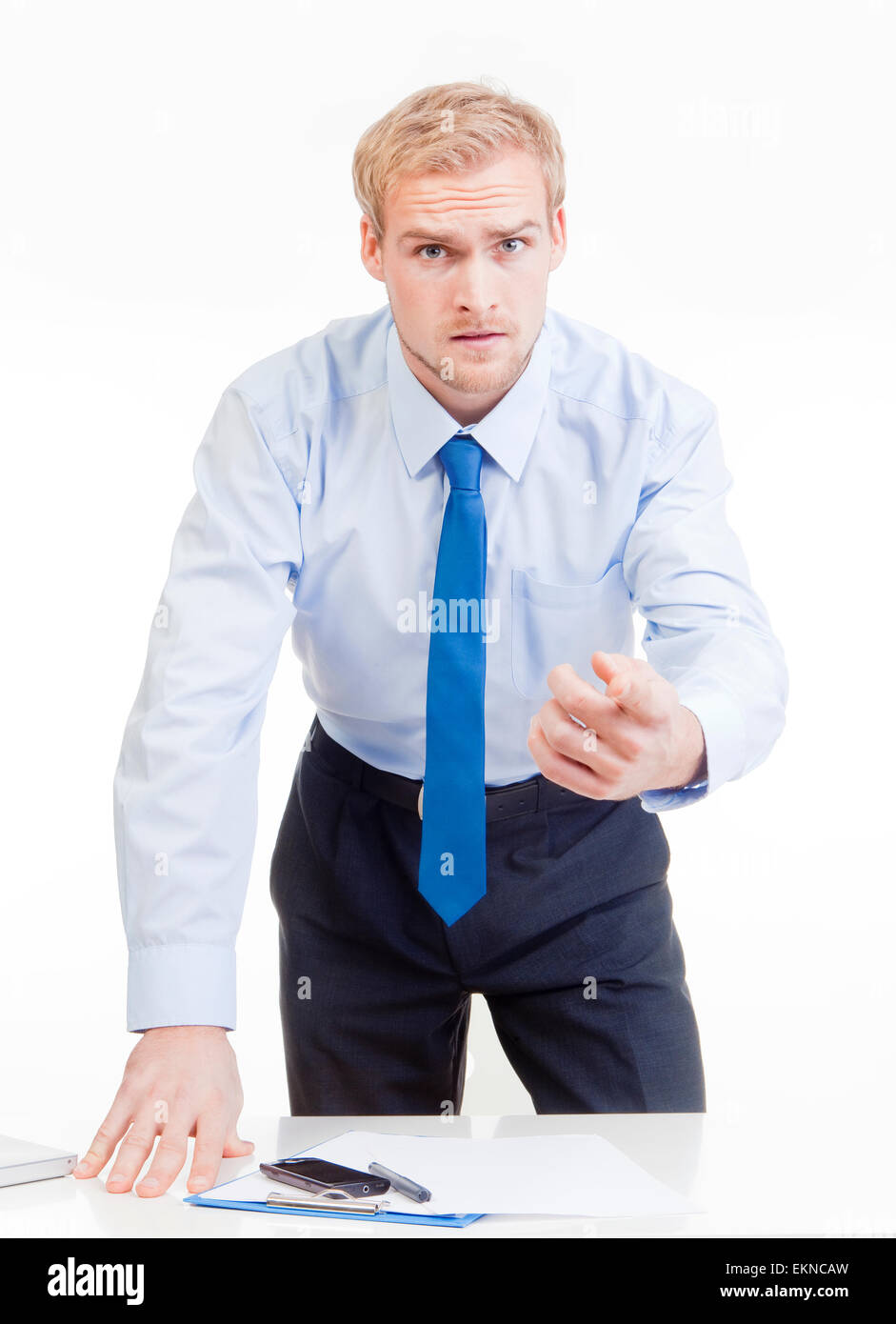 Angry boss standing behind desk hi-res stock photography and images - Alamy