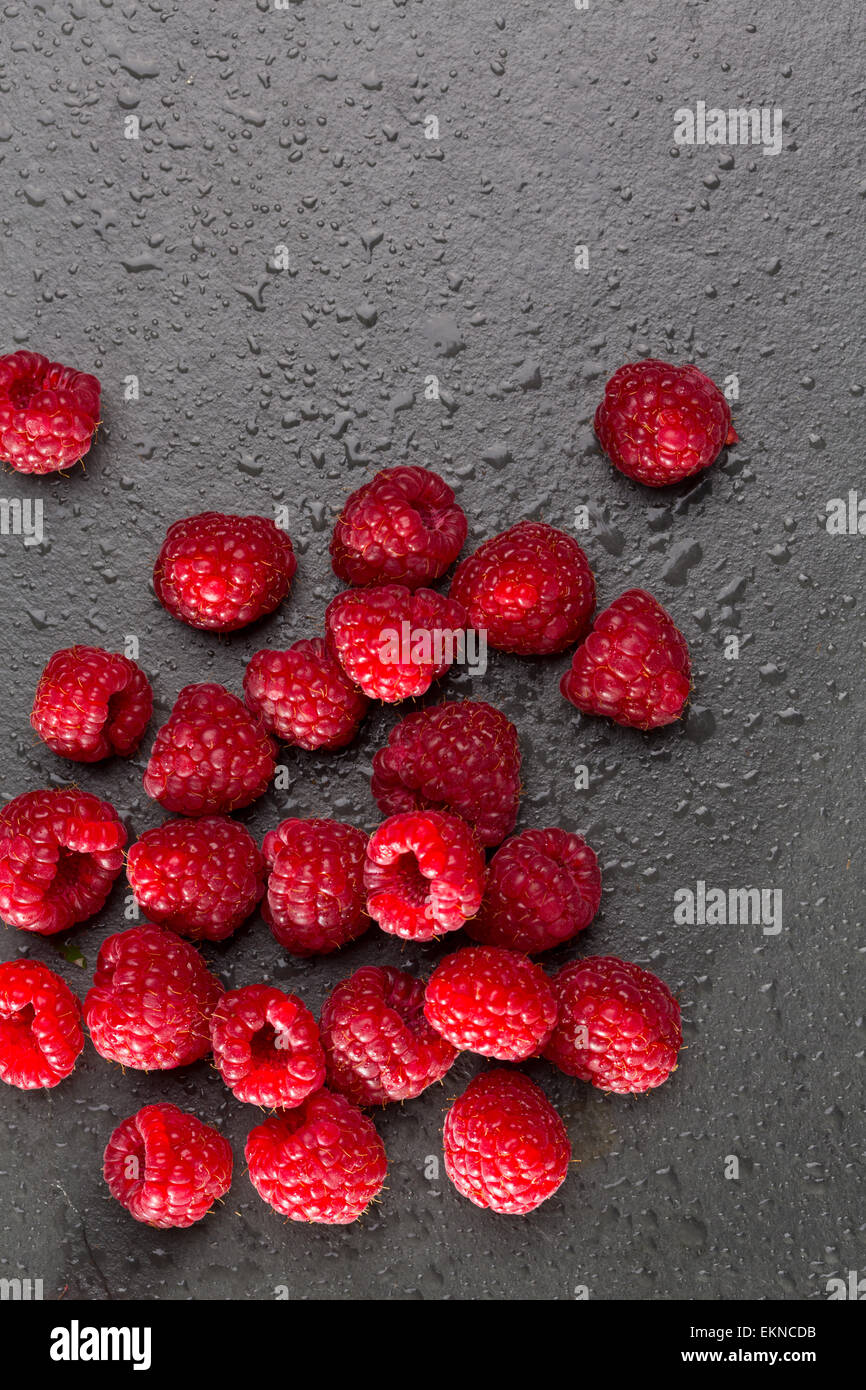 berries raspberry on black slate background Stock Photo - Alamy