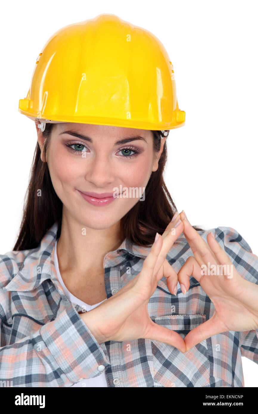 young craftswoman making a hearth sign with her hands Stock Photo - Alamy