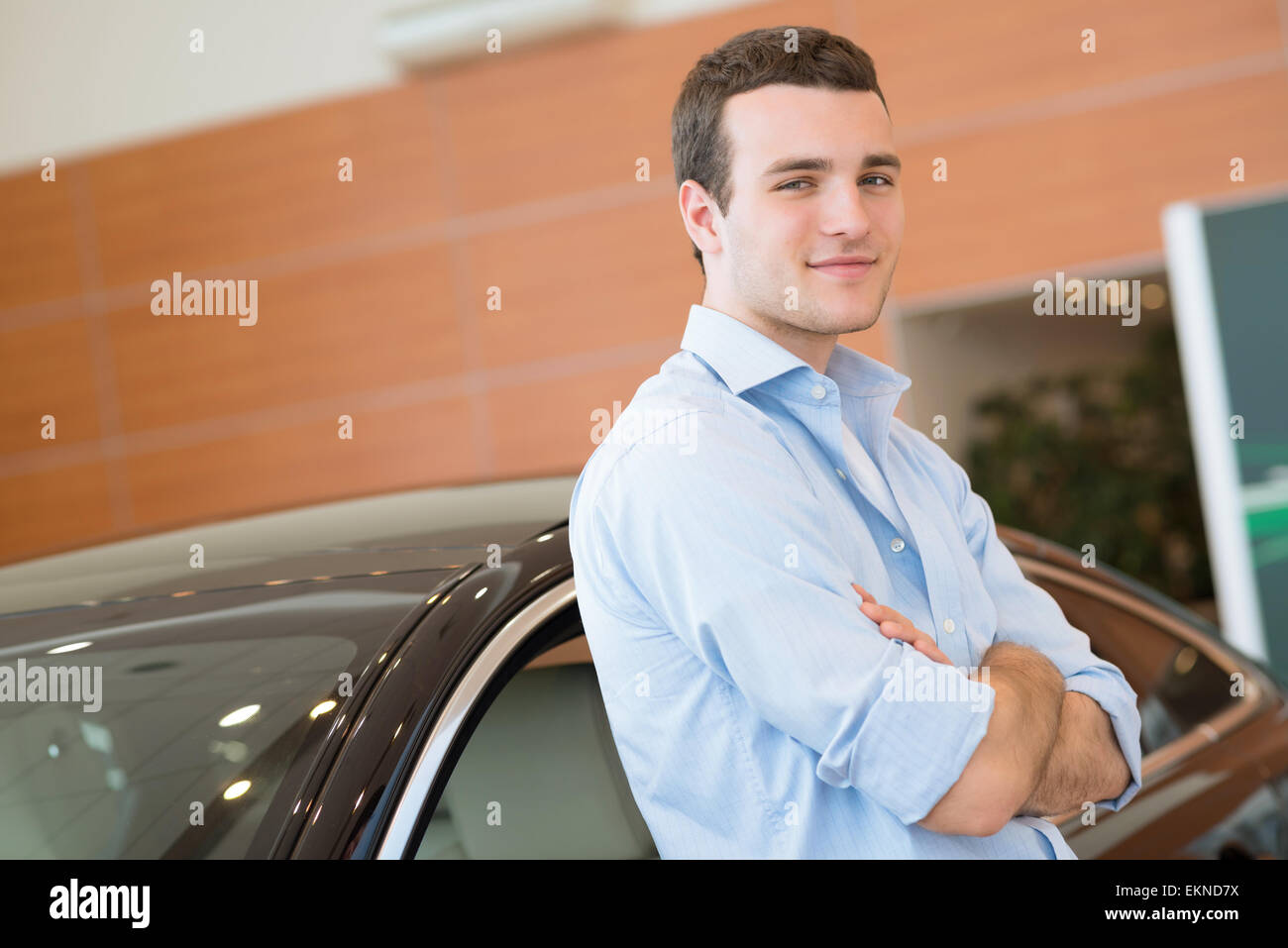 man standing near a car Stock Photo - Alamy