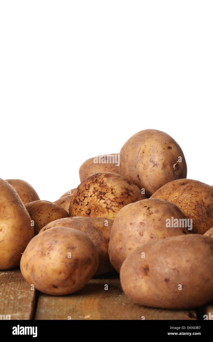 Rustic unpeeled potatoes on a table Stock Photo - Alamy