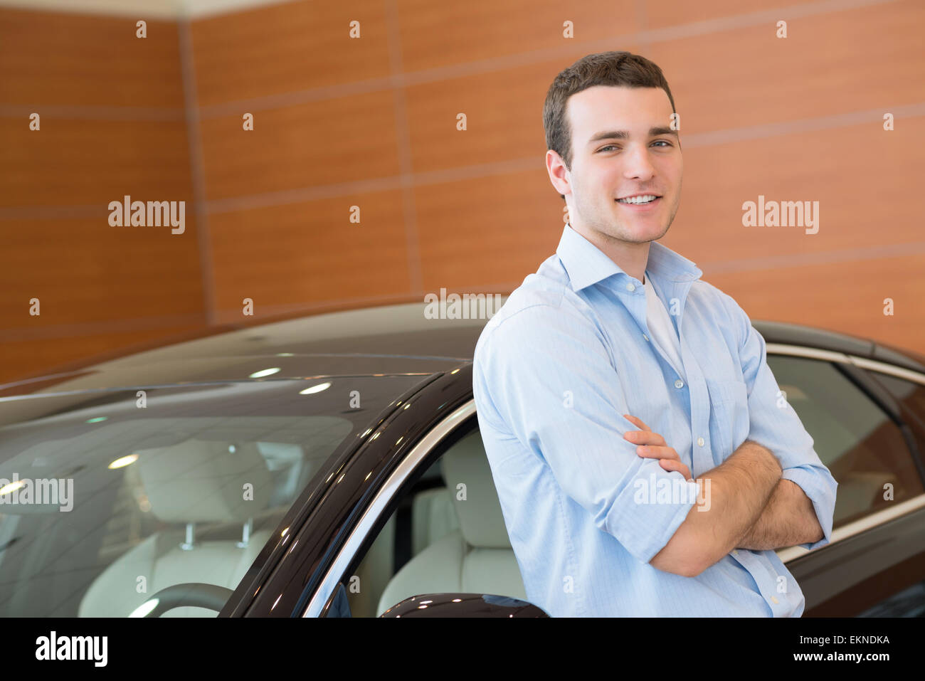 man standing near a car Stock Photo - Alamy