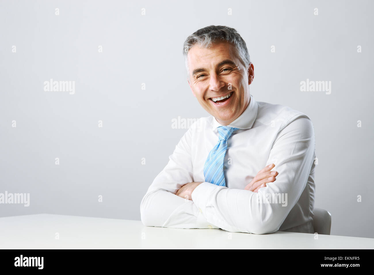 Business man smiling Stock Photo - Alamy