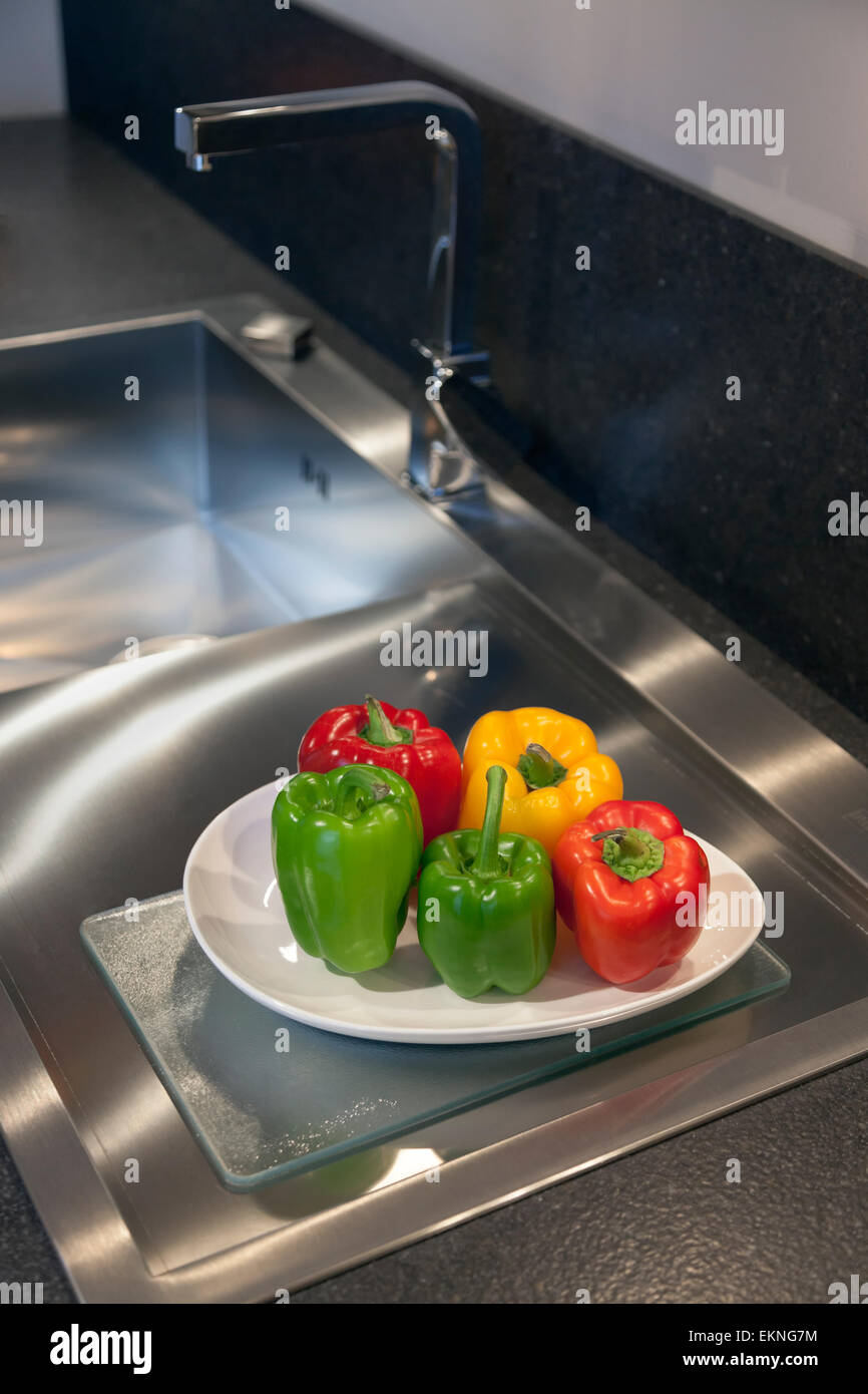 Colorful Peppers In A Modern Kitchen Stock Photo - Alamy