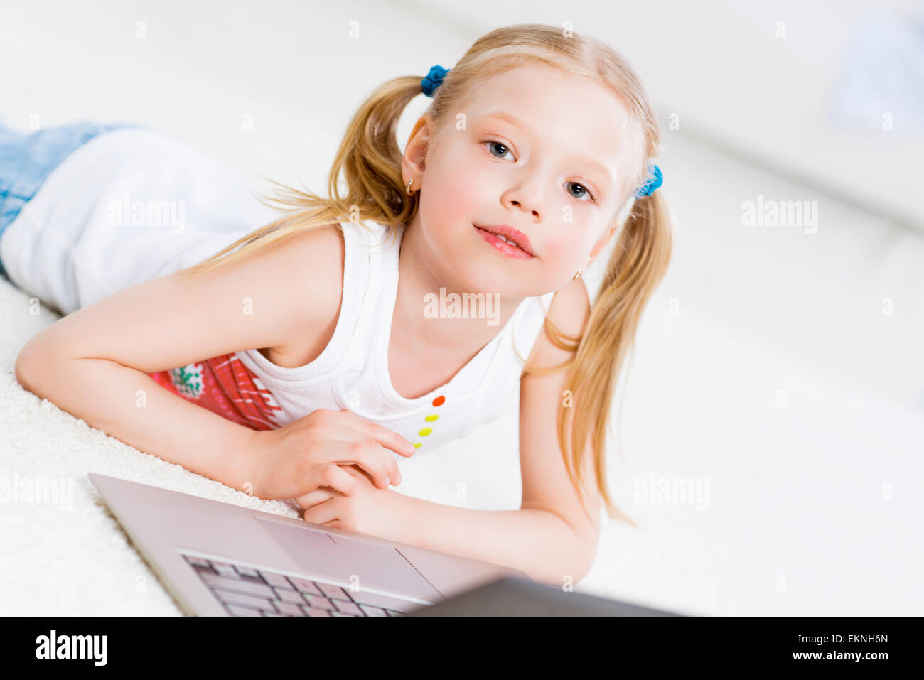 Pretty girl working on a laptop Stock Photo - Alamy