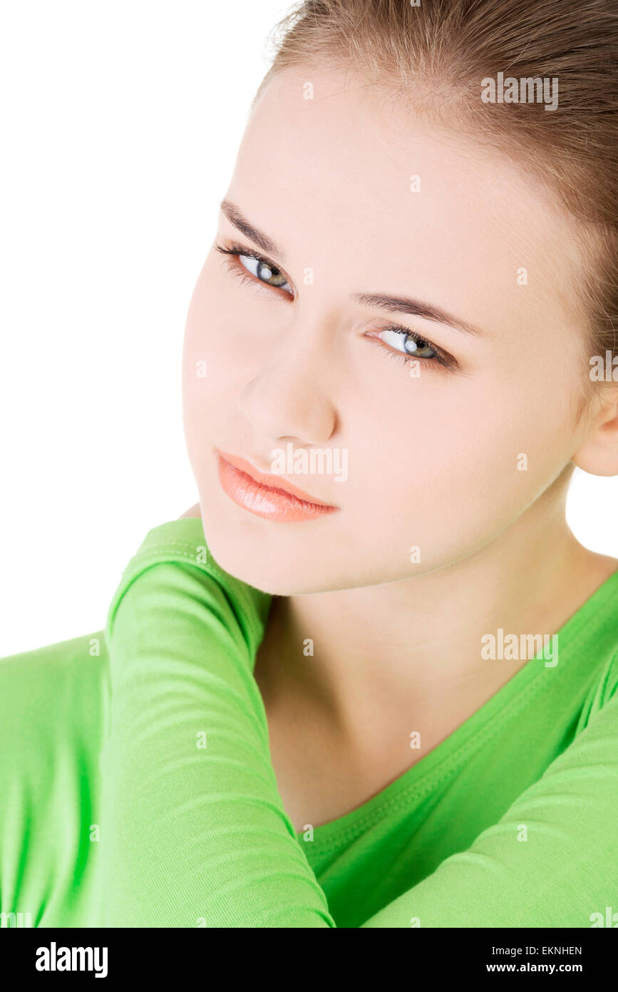 Young woman holding hand on her neck Stock Photo - Alamy