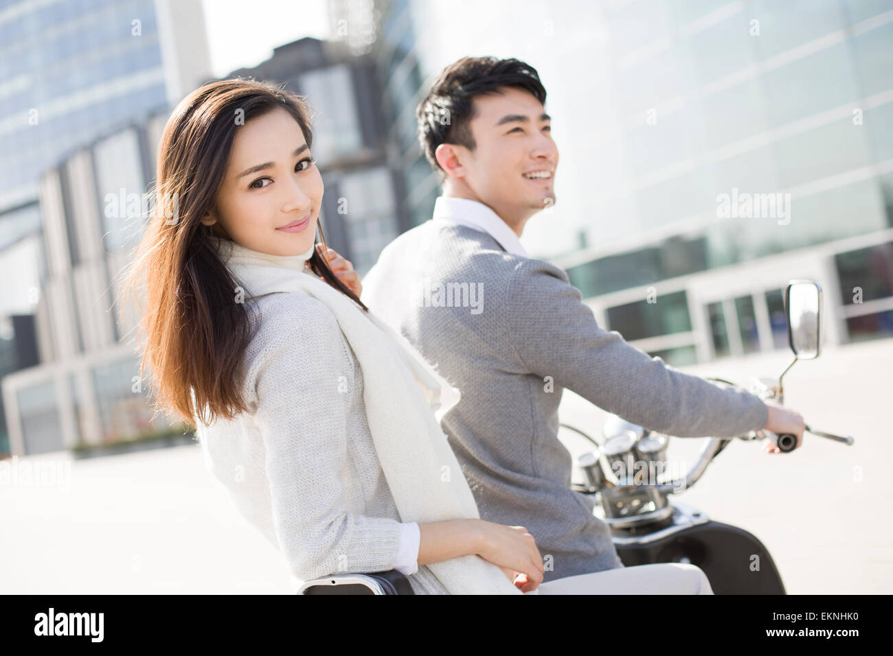 Young couple riding motorcycle together Stock Photo - Alamy