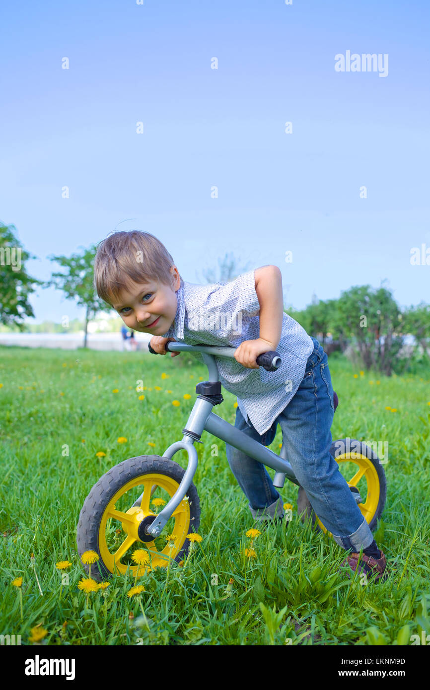 Little boy on a bicycle Stock Photo - Alamy