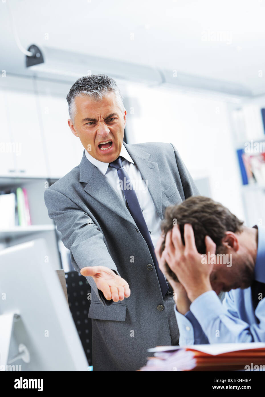Yelling at an employee Stock Photo - Alamy