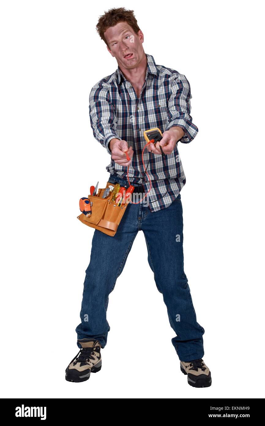 Disoriented man holding a multimeter Stock Photo - Alamy