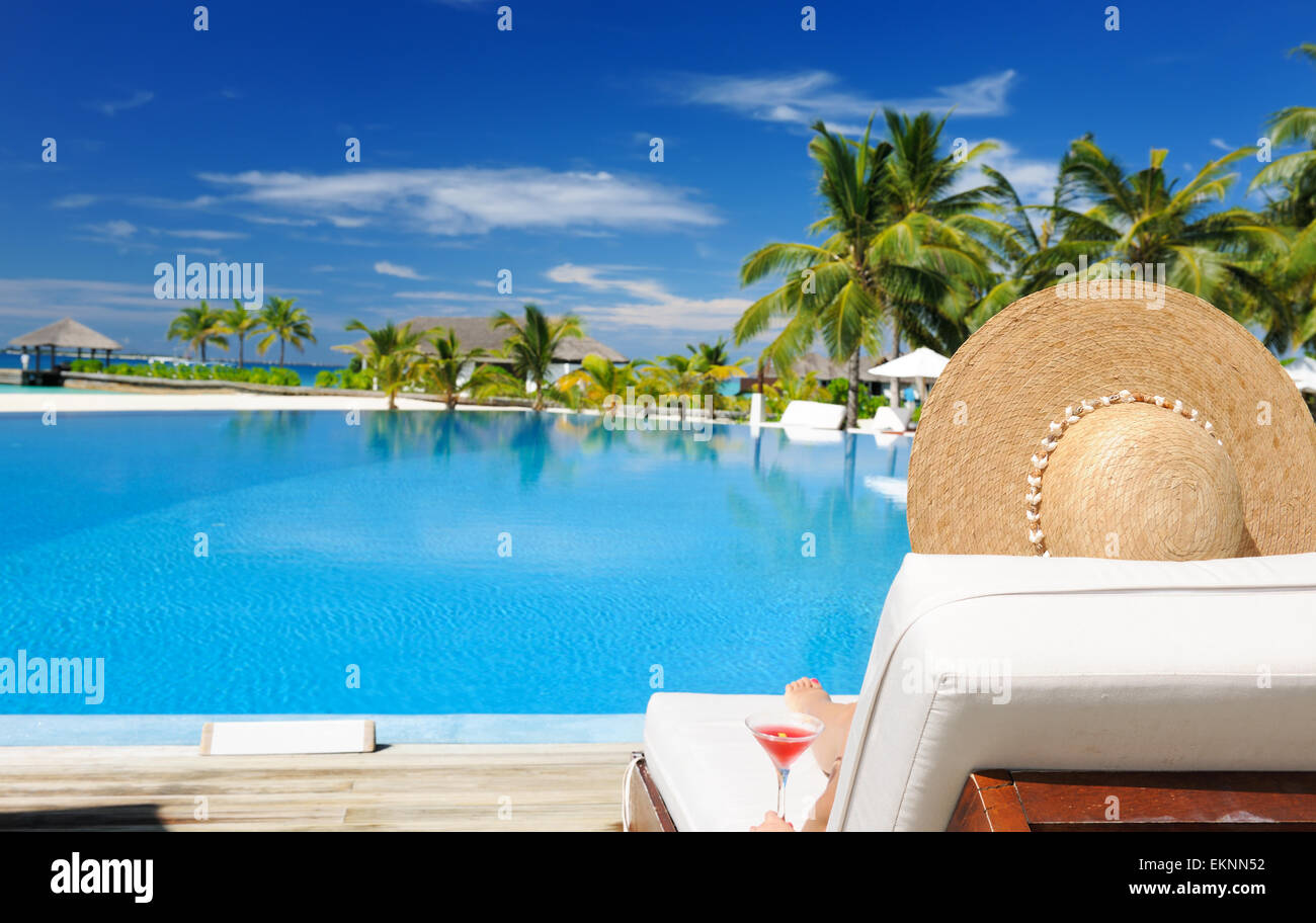 Woman at poolside with cosmopolitan cocktail Stock Photo - Alamy