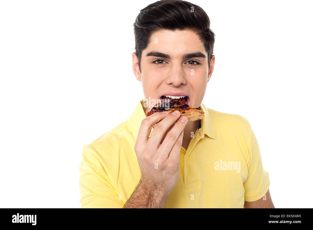 Handsome guy enjoying yummy pizza slice Stock Photo - Alamy