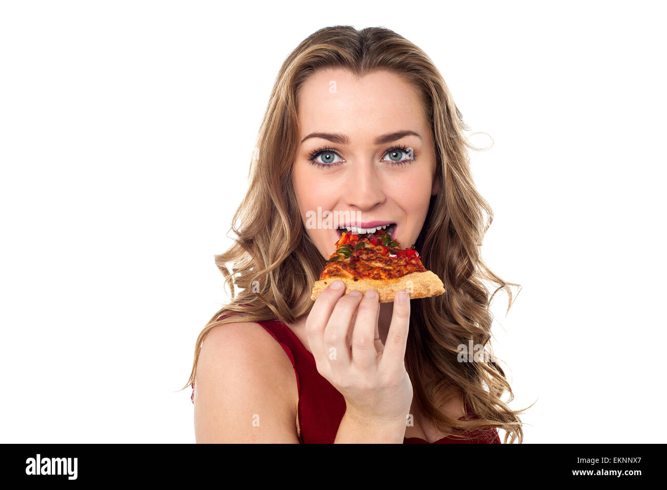 Young female having yummy pizza slice Stock Photo - Alamy