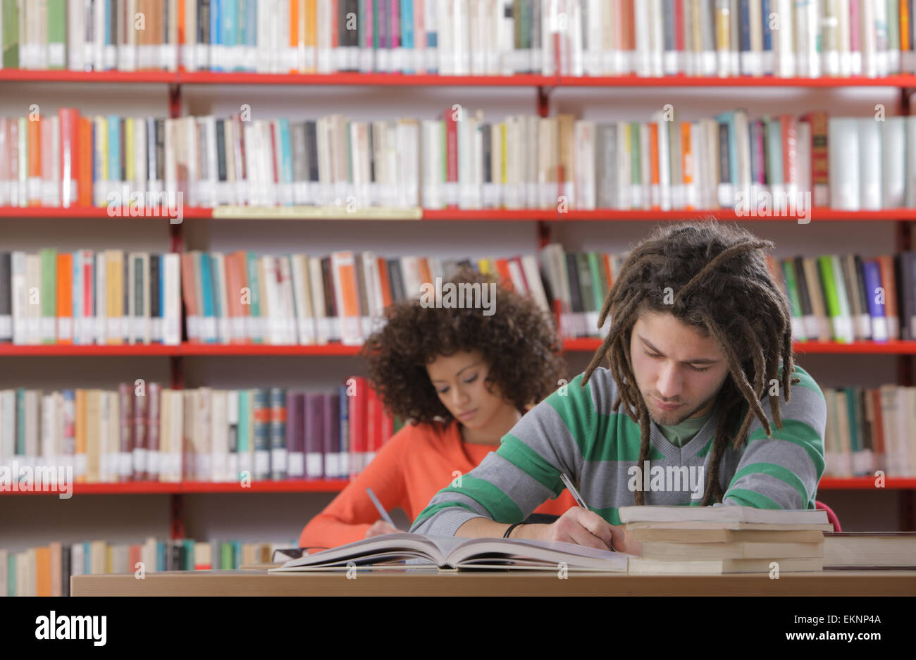 Two students in a library Stock Photo - Alamy