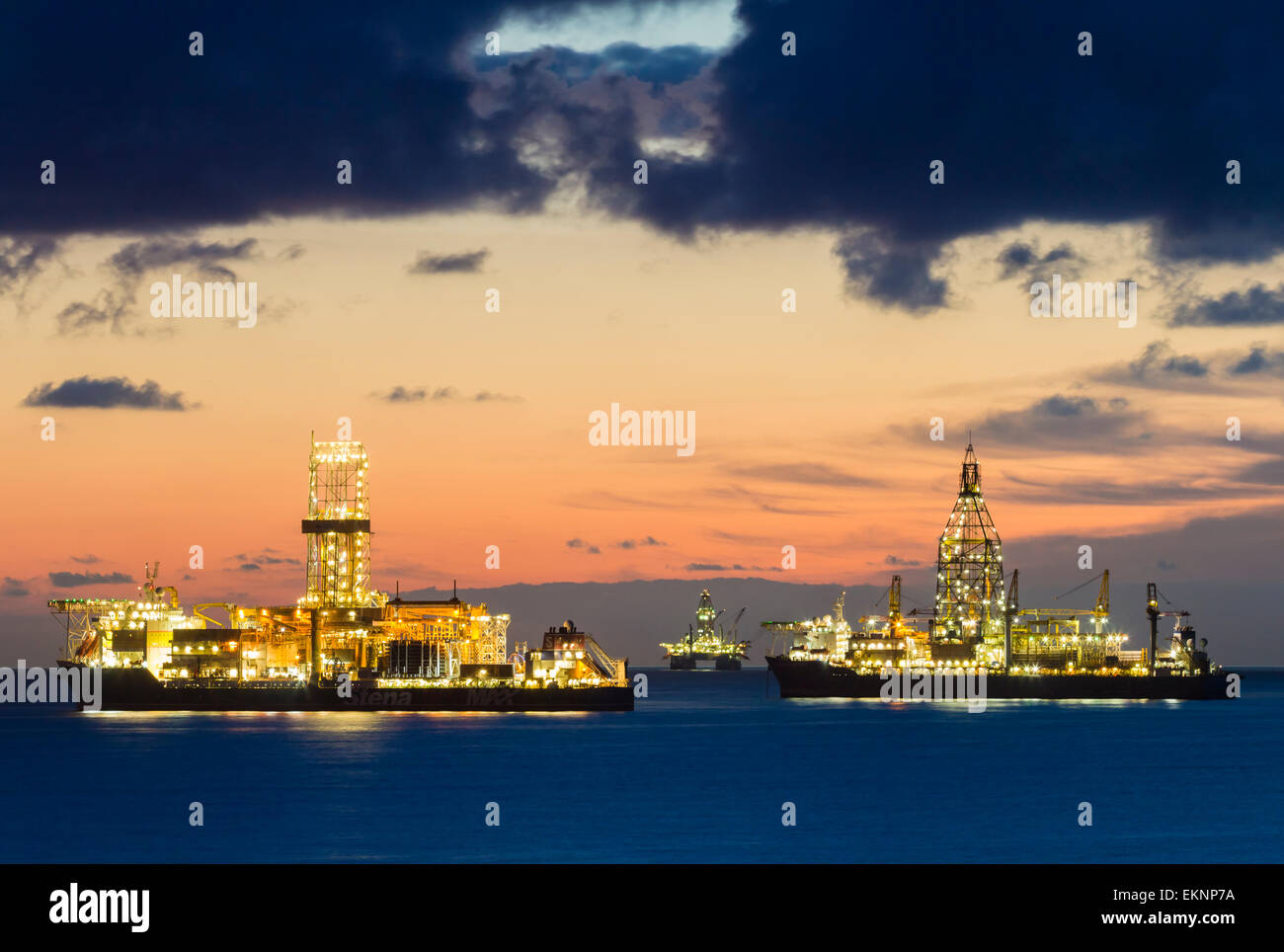 Drill ships/oil rigs at sunrise in Atlantic Ocean Stock Photo - Alamy