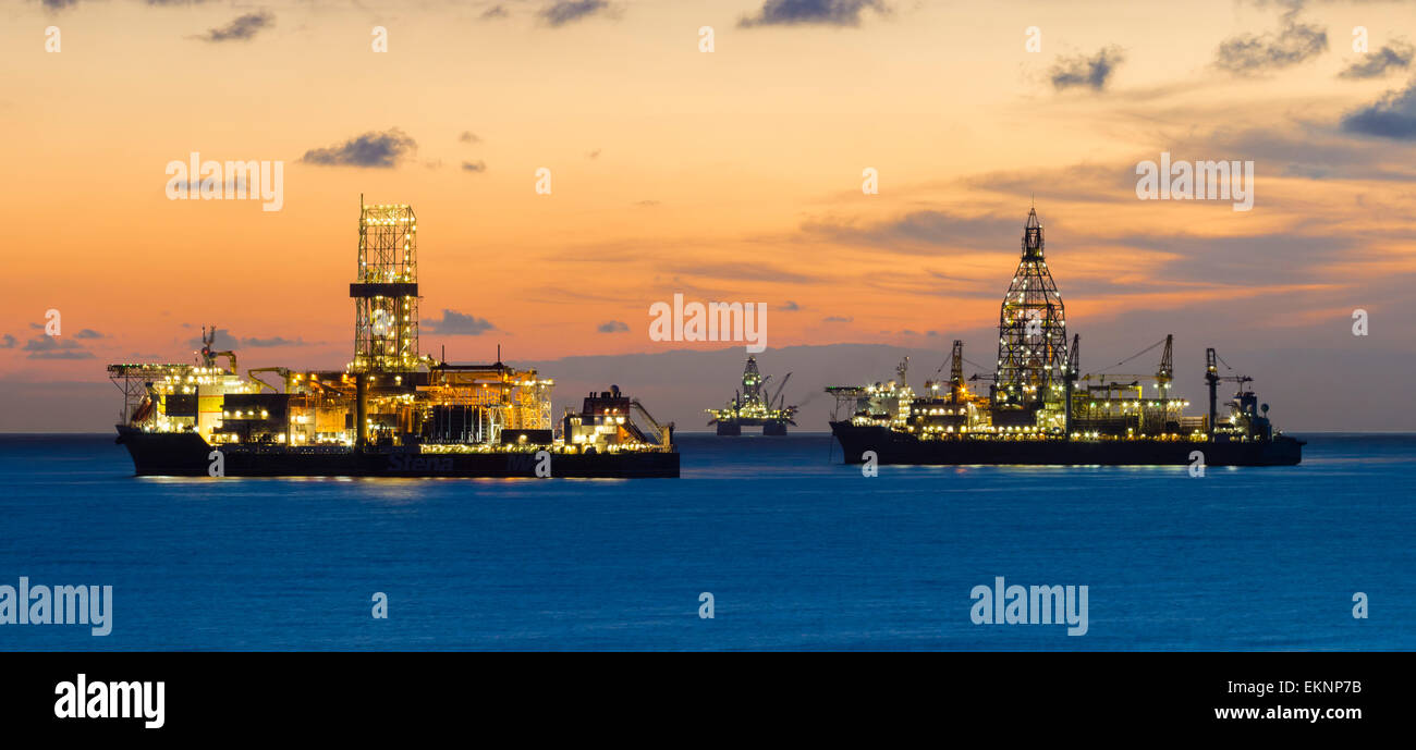 Drill ships/oil rigs at sunrise in Atlantic Ocean Stock Photo - Alamy