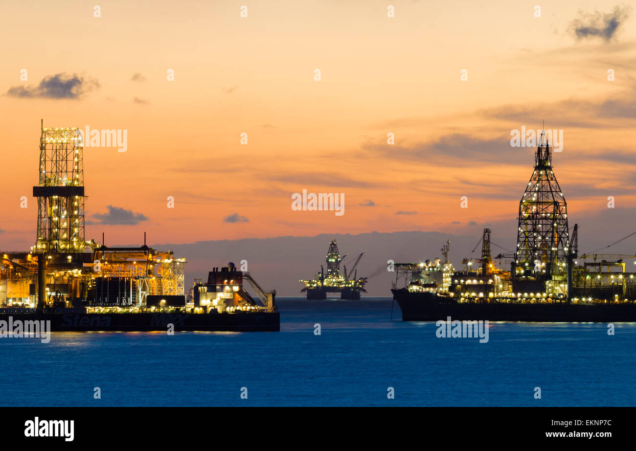 Drill ships/oil rigs at sunrise in Atlantic Ocean Stock Photo - Alamy