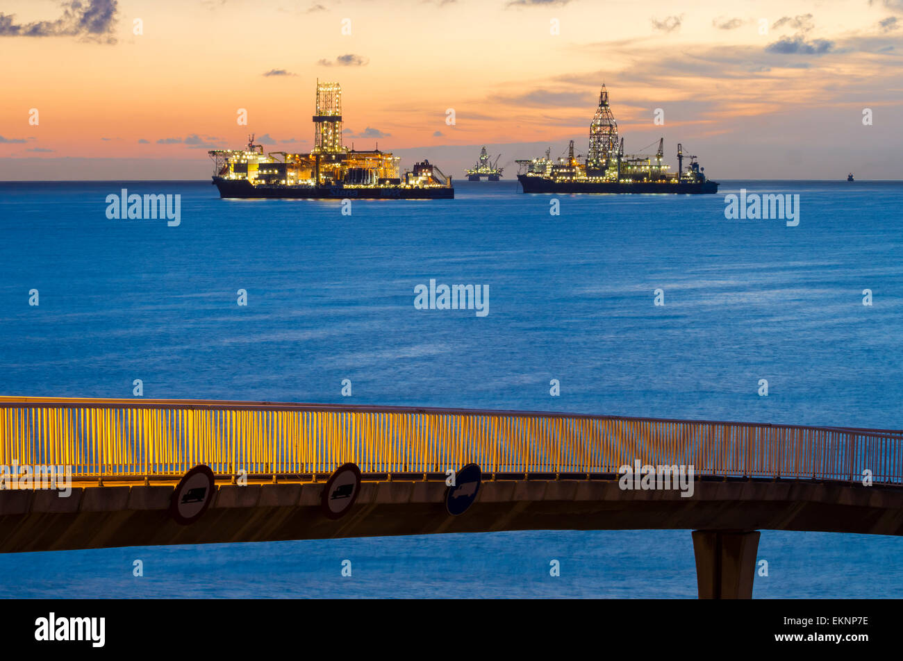 Drill ships/oil rigs at sunrise in Atlantic Ocean Stock Photo - Alamy