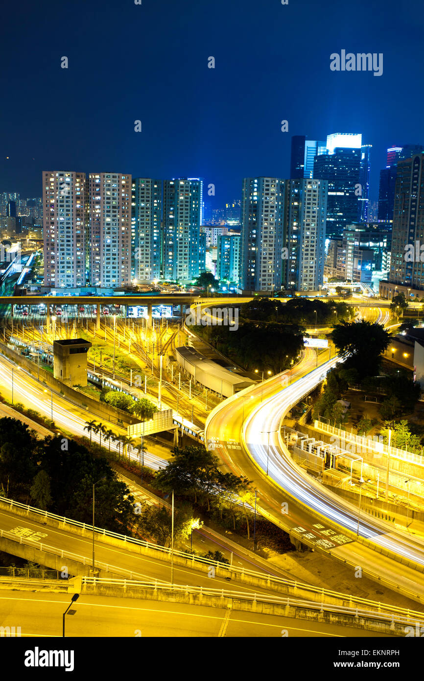 Office buildings and highway in city at night Stock Photo - Alamy