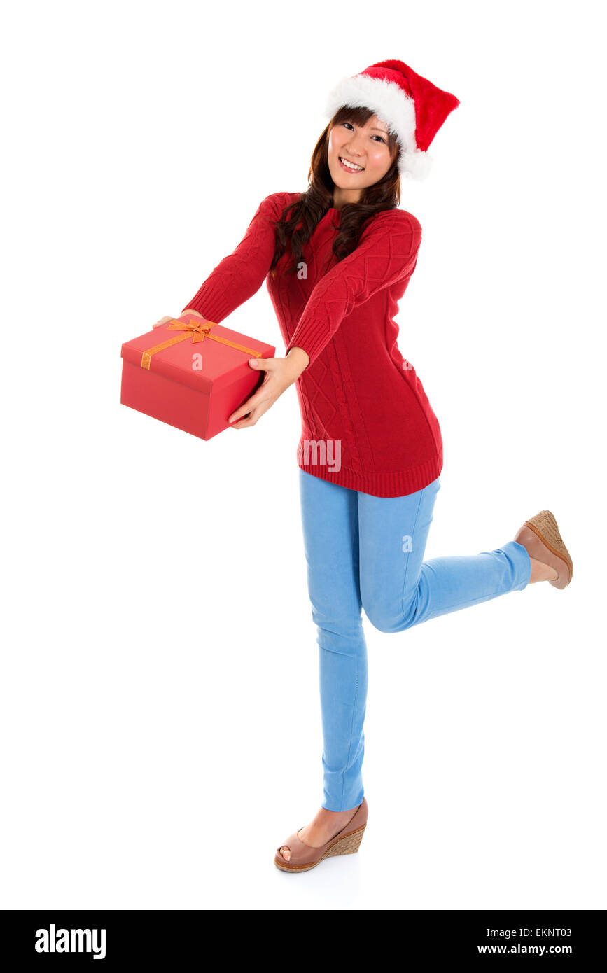 Santa girl and Christmas gift Stock Photo - Alamy