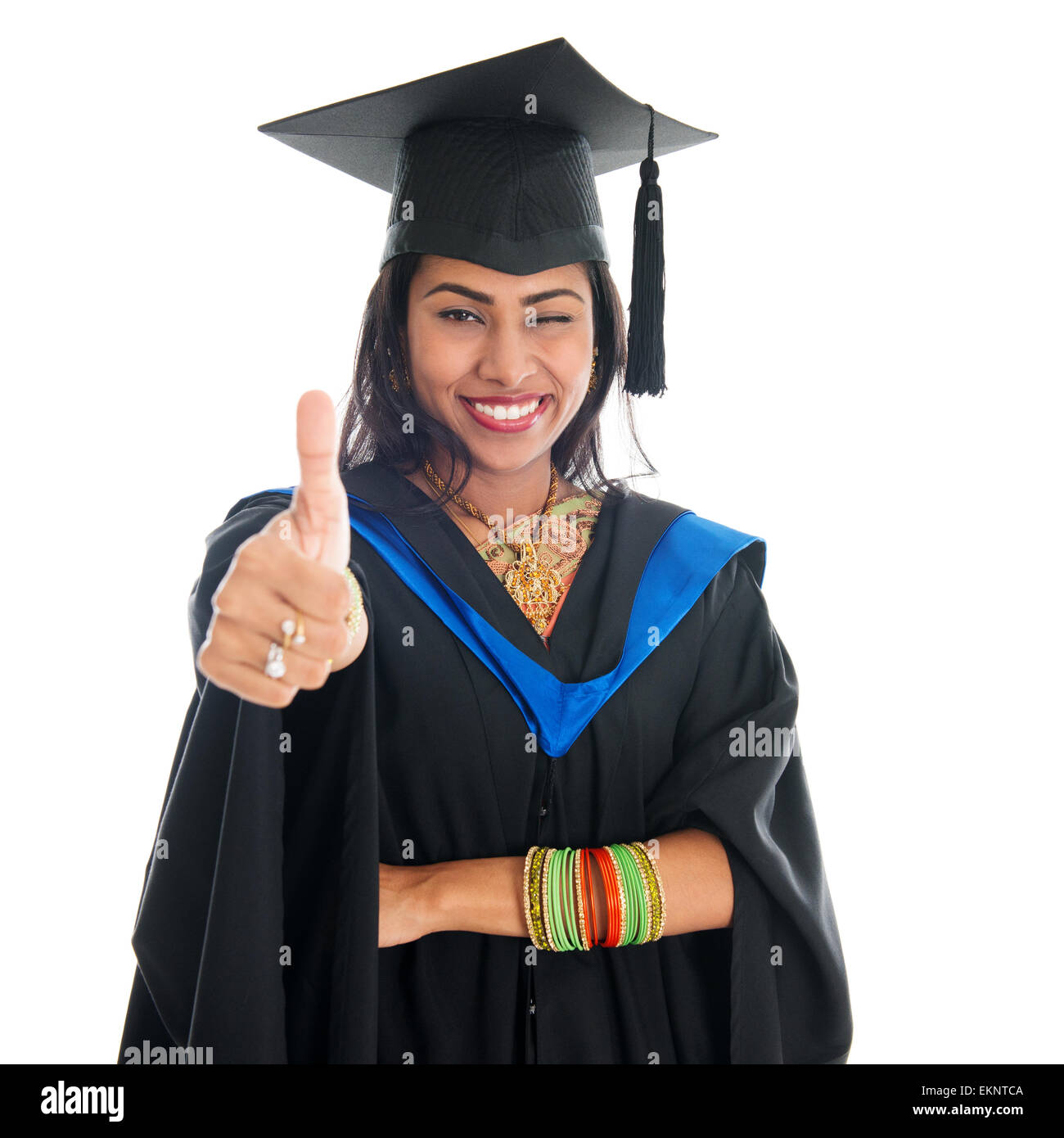 Indian graduate student giving thumb up hand sign Stock Photo - Alamy