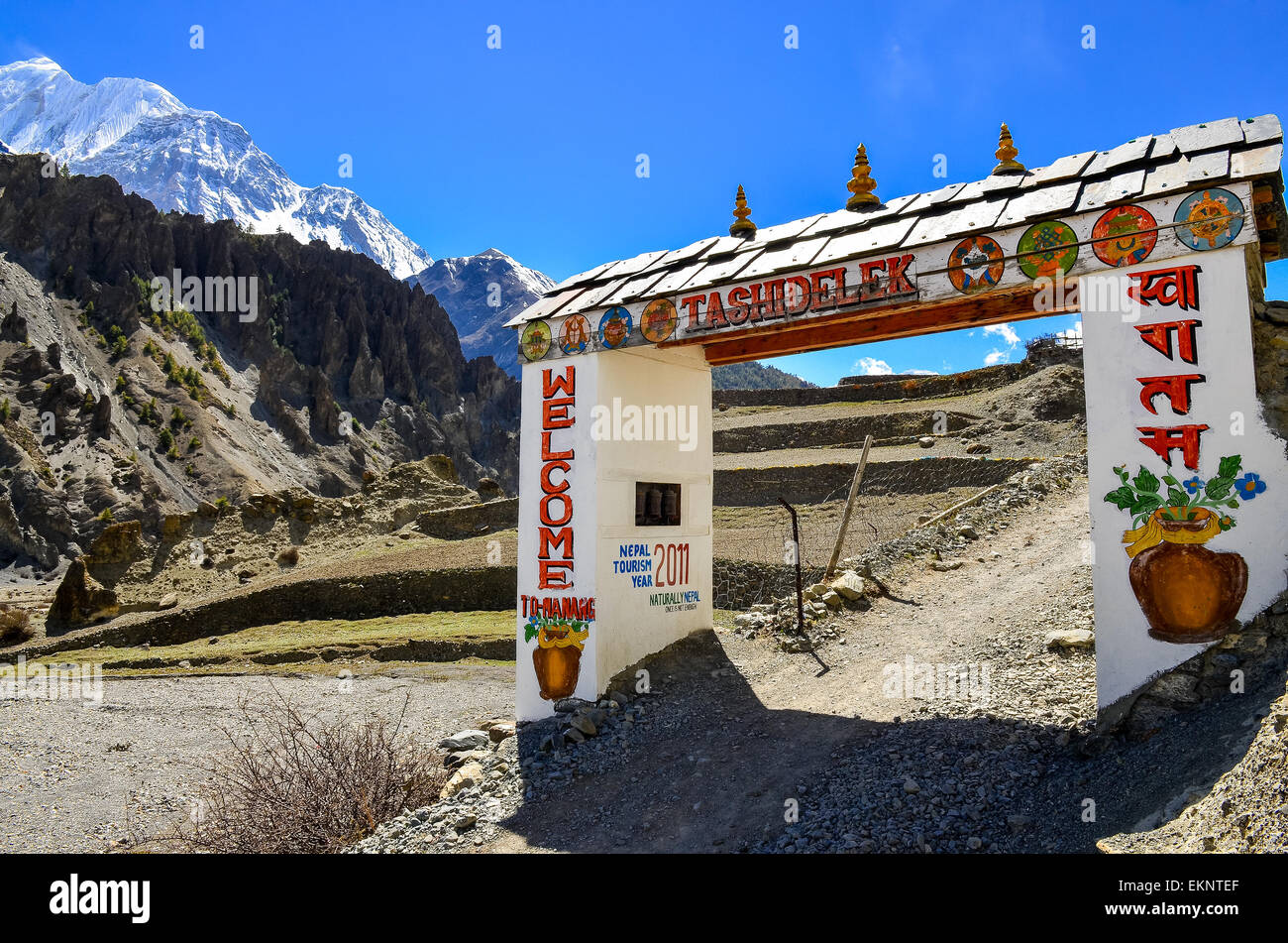 Entrance gate with welcome sign, Manang, Nepal Stock Photo - Alamy