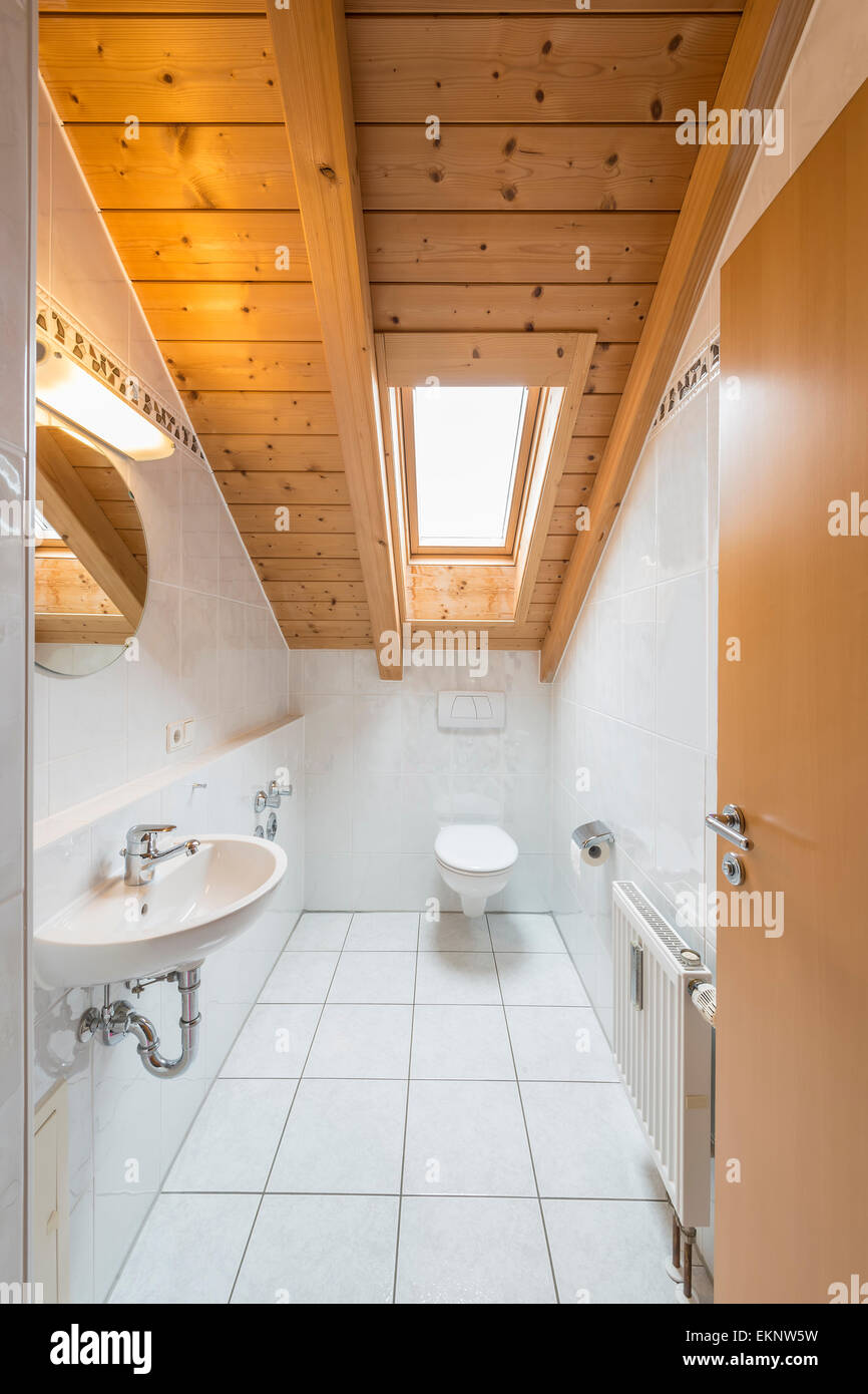 White tiled restroom Stock Photo - Alamy