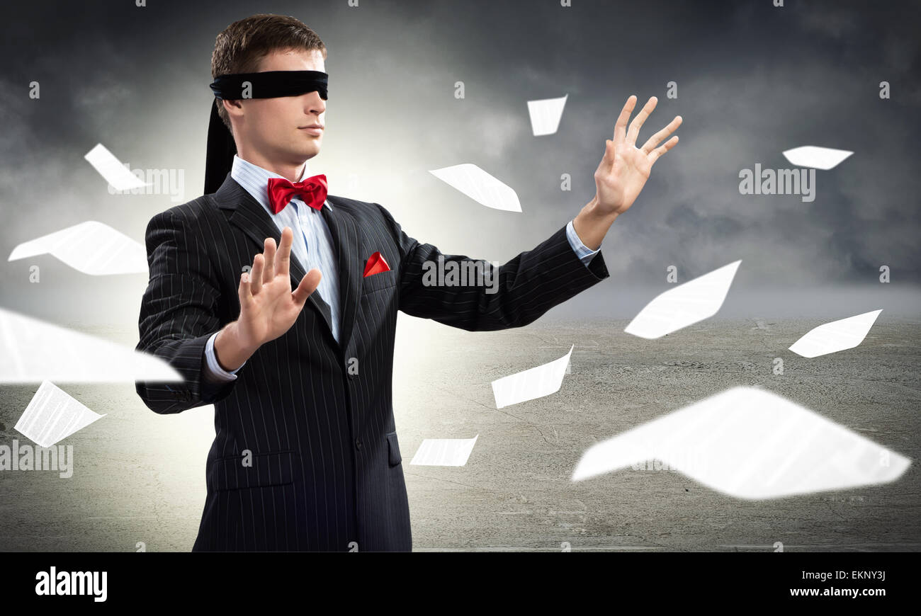 Blindfolded young man feeling way hi-res stock photography and images ...