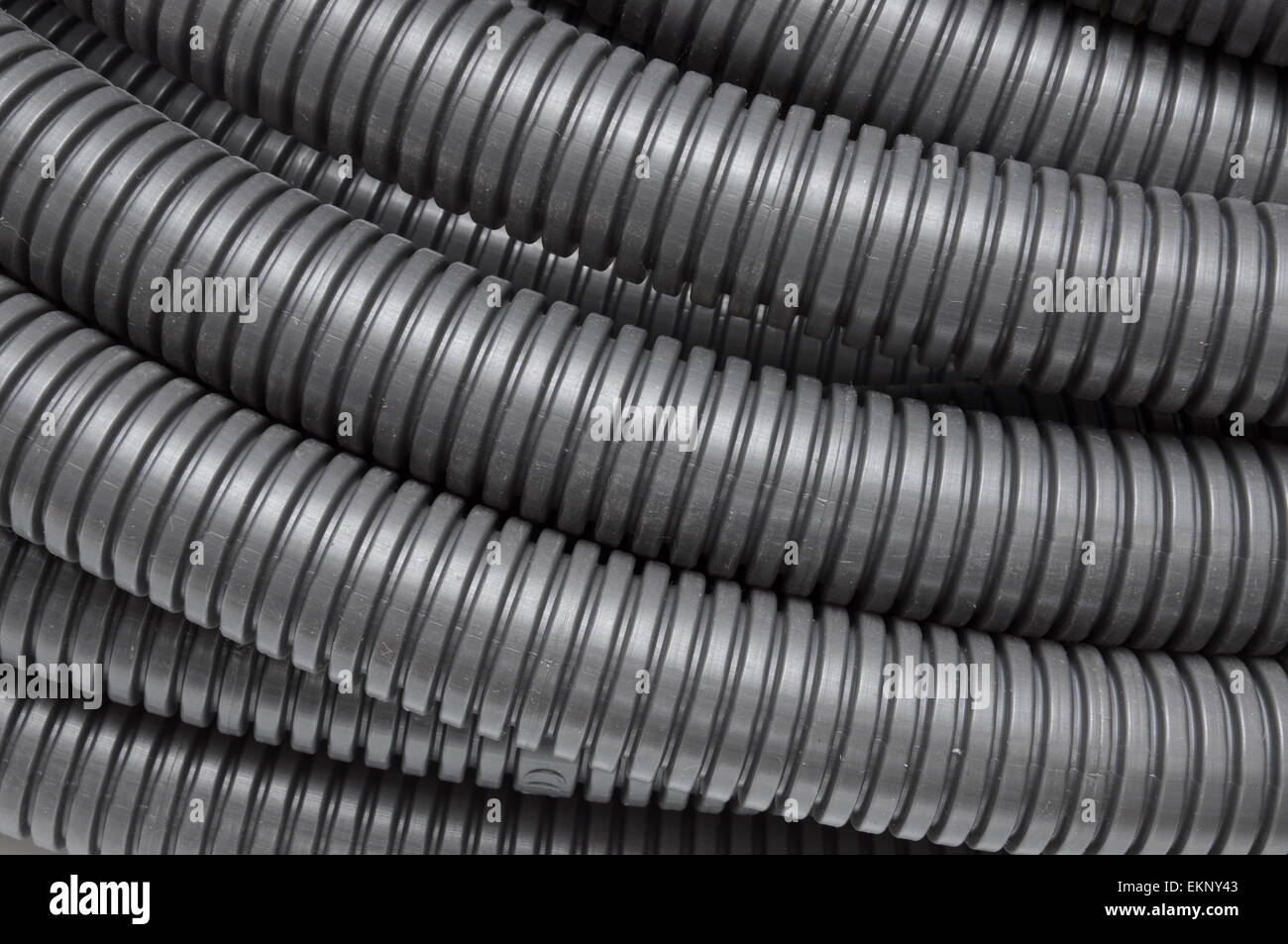 Black corrugated pipes Stock Photo - Alamy