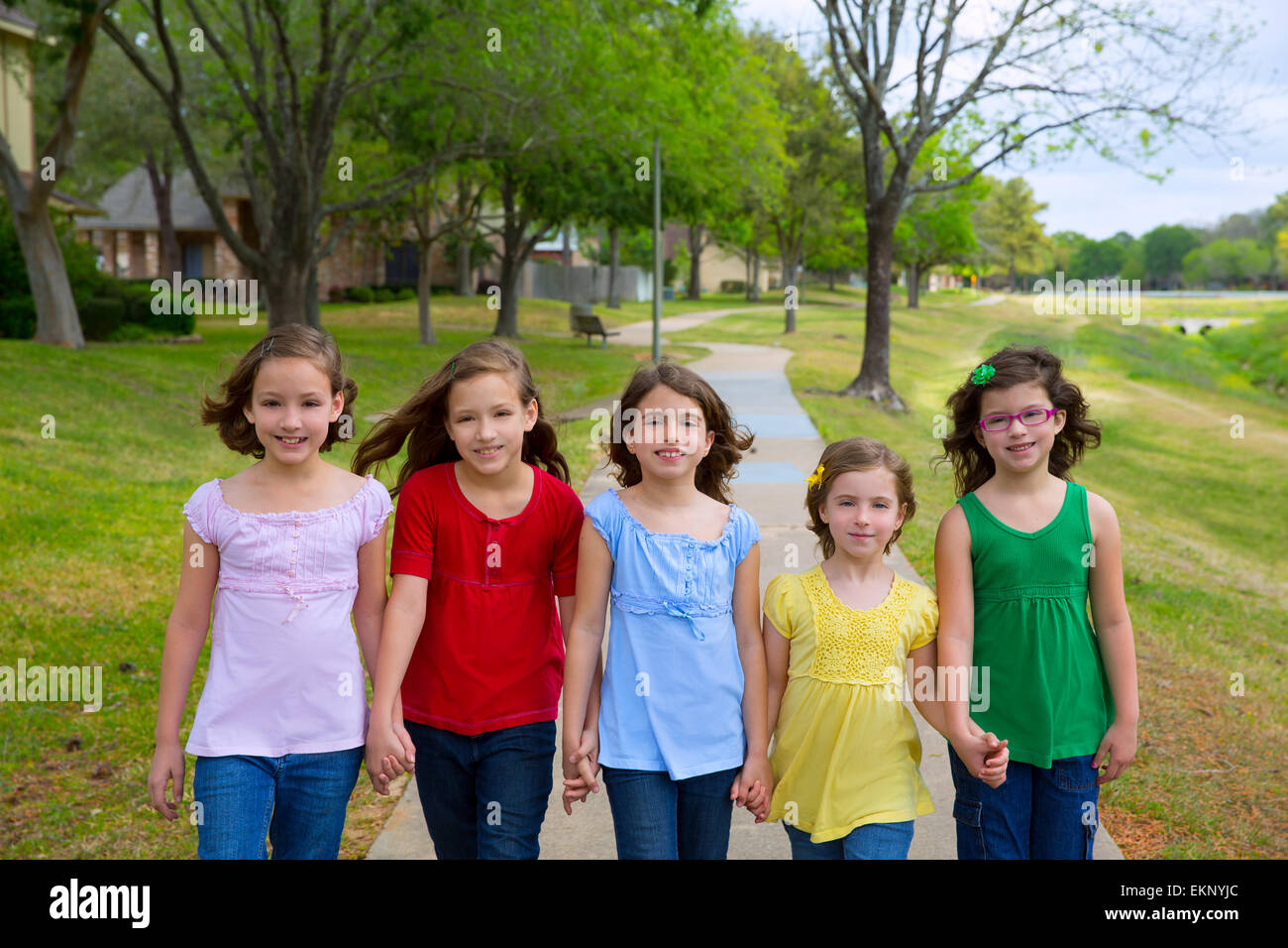 Children group of sisters girls and friends walking in park Stock Photo ...