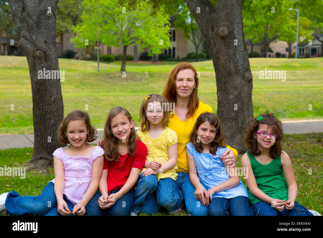 Mother teacher with daughter pupils in playground park Stock Photo - Alamy