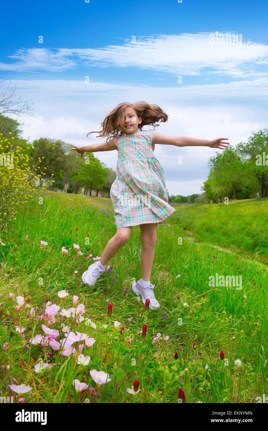 happy children girl jumping on spring poppy flowers Stock Photo - Alamy