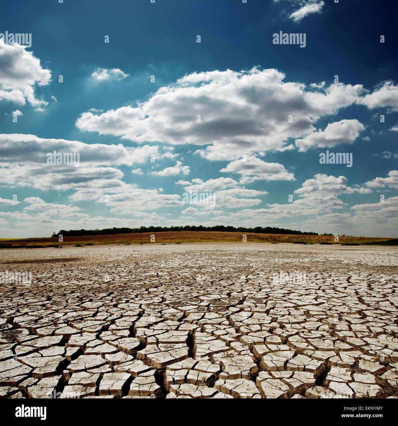 dramatic sky with clouds over cracked earth Stock Photo - Alamy