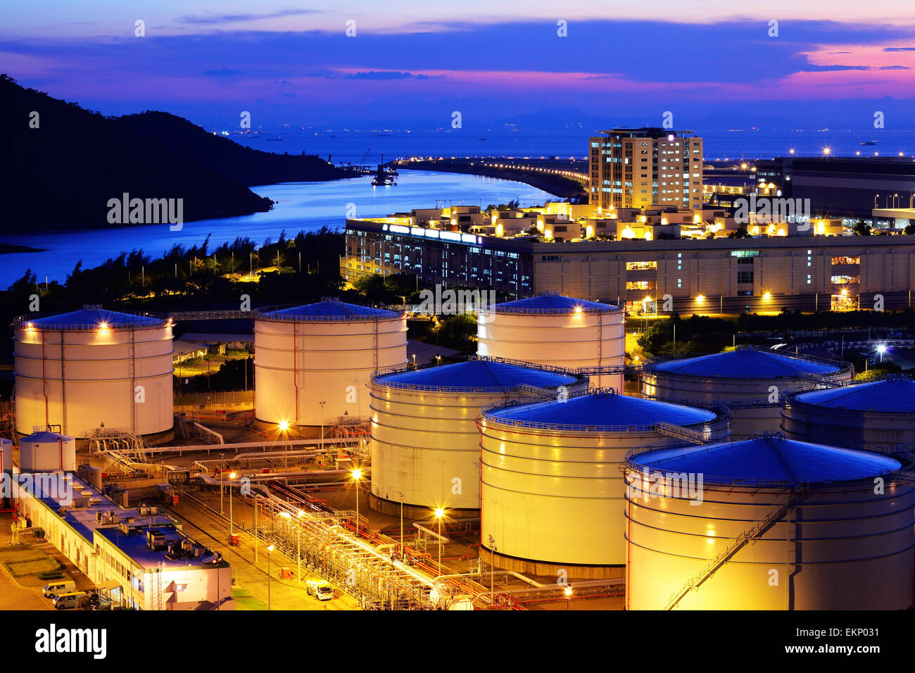 Oil tank in cargo terminal Stock Photo - Alamy