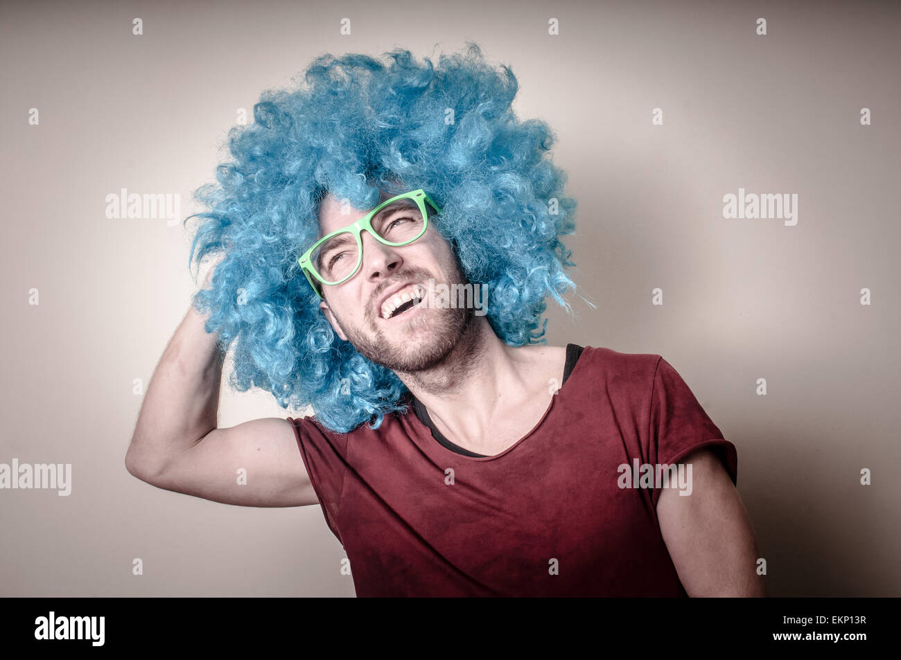 hipster stylish funny man with blue wig Stock Photo - Alamy